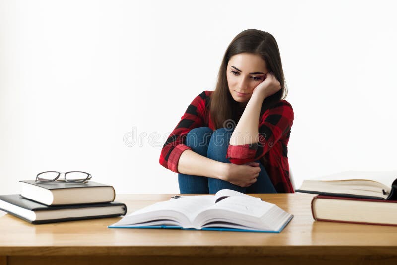 Young Student with Desperate Expression Sitting at Her Desk. Stock ...