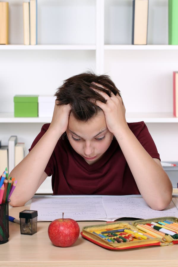 Young Student Desperate and Overworked with Homework at School Stock ...