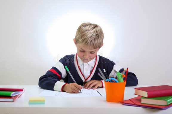 Young Student Doing His Homework Stock Photo - Image of exam, sitting ...