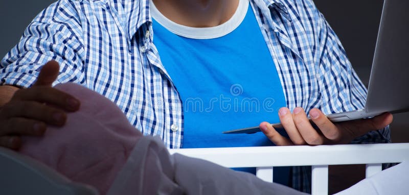 Young Student Doing Homework and Looking after Newborn Baby Stock Photo ...