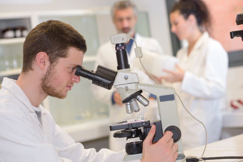 Young Student Doing Reserch with Microscope Stock Image - Image of ...
