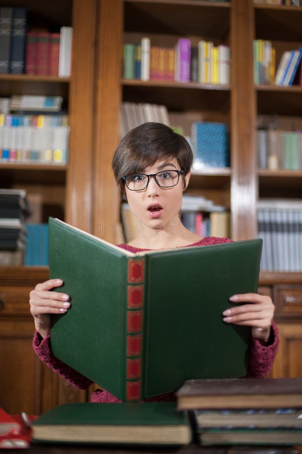Young Student Find Solution on a Book Stock Image - Image of bookcase ...