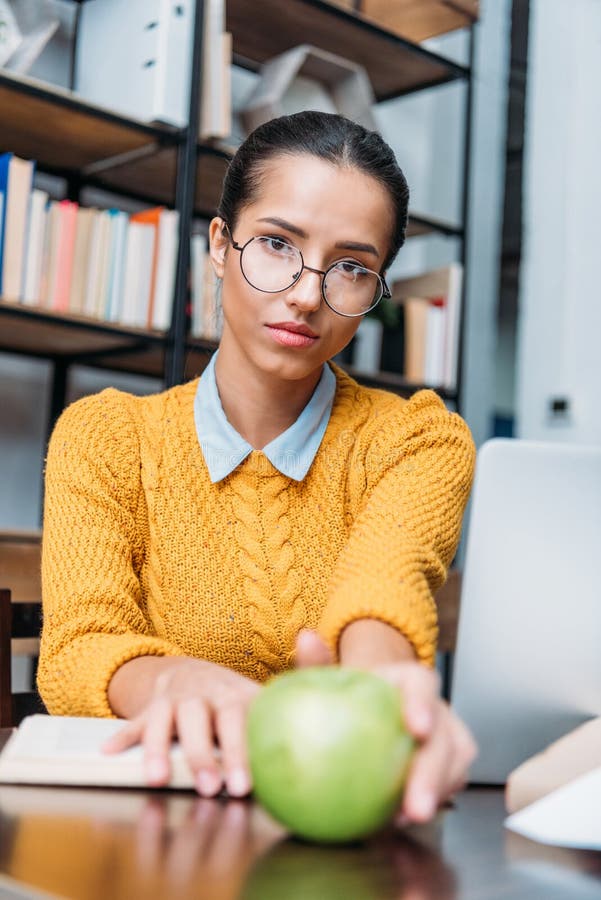 Young Student Girl Preparing for Exam at Library and Holding Stock ...