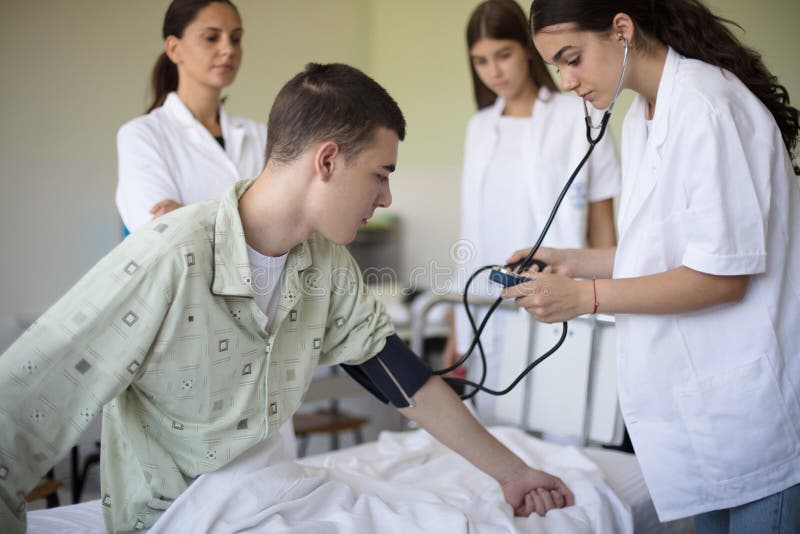 Student in Hospital Measures the Patient`s Pressure Stock Image - Image ...