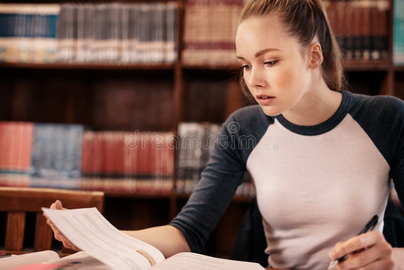 Young Student Learning Book in Library Stock Photo - Image of high ...
