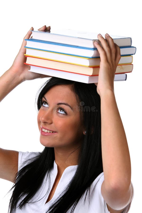 Young Student Learns a Stack of Books on the Head Stock Photo - Image ...