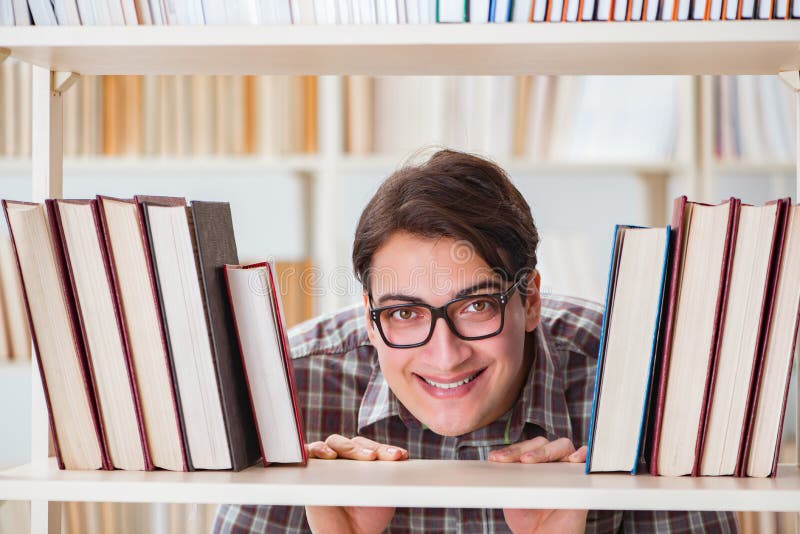 The Young Student Looking for Books in College Library Stock Photo ...