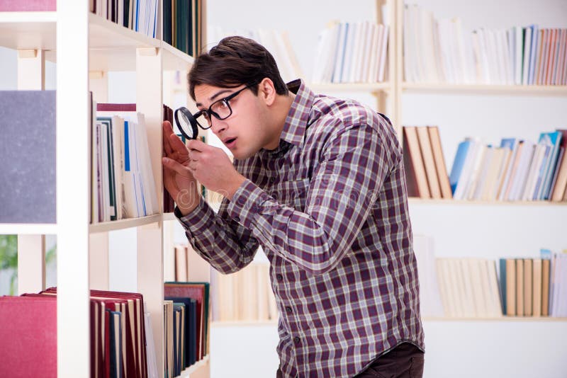 The Young Student Looking for Books in College Library Stock Photo ...