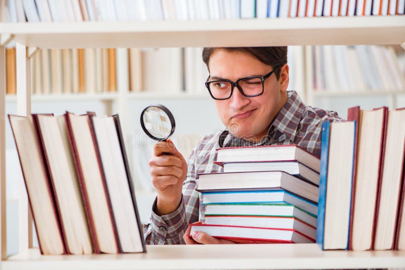 The Young Student Looking for Books in College Library Stock Photo ...