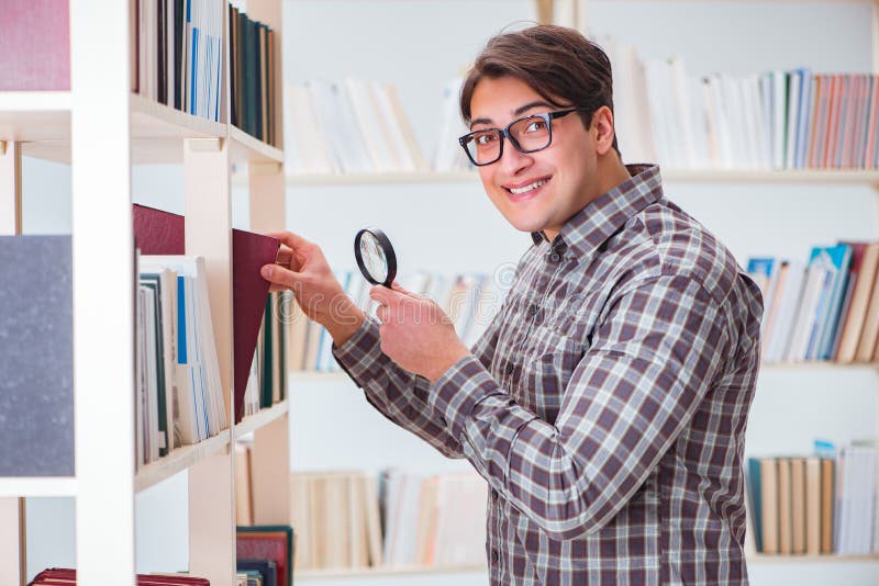 The Young Student Looking for Books in College Library Stock Photo ...