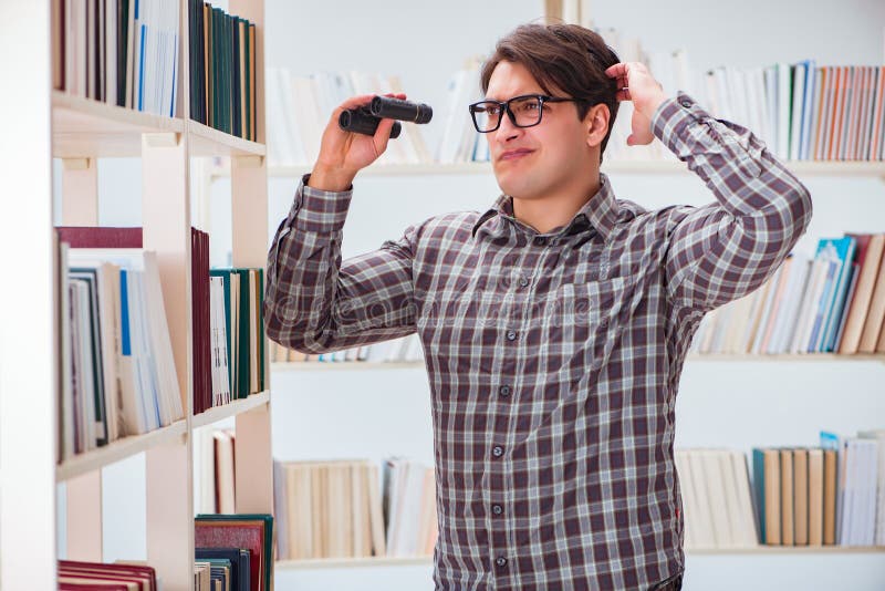 The Young Student Looking for Books in College Library Stock Photo ...