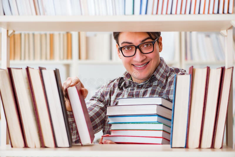 The Young Student Looking for Books in College Library Stock Photo ...