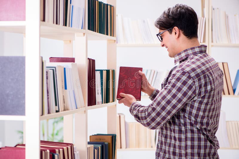 The Young Student Looking for Books in College Library Stock Photo ...