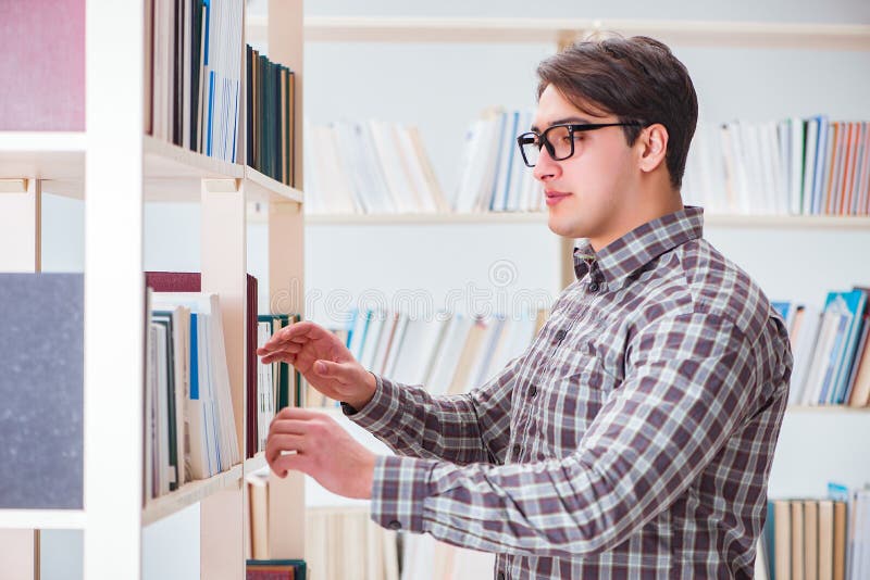 The Young Student Looking for Books in College Library Stock Image ...