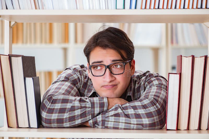 The Young Student Looking for Books in College Library Stock Photo ...