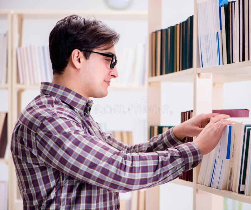 Young Student Looking for Books in College Library Stock Photo - Image ...