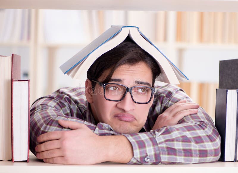 Young Student Looking for Books in College Library Stock Photo - Image ...