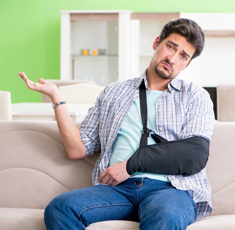 Young Student Man with Hand Injury Sitting on the Sofa Stock Image ...