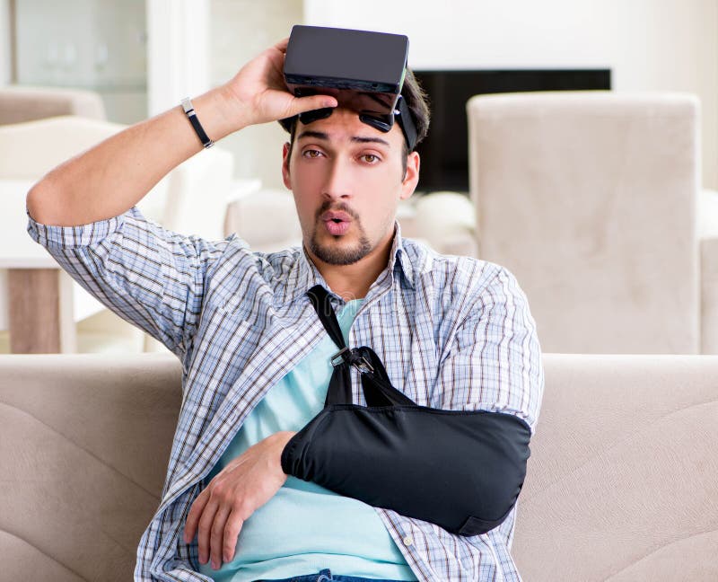 Young Student Man with Hand Injury Wearing Virtal Glasses Stock Image ...