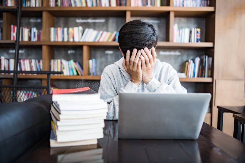 Young Student Man Tired of Computer Sitting at Cafe Table Stock Image ...