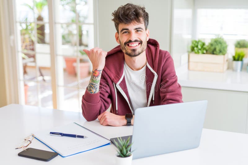 Young Student Man Using Computer Laptop and Notebook Pointing and ...