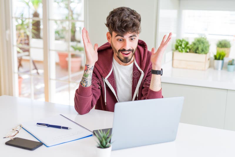 Young Student Man Using Computer Laptop and Notebook Very Happy and ...