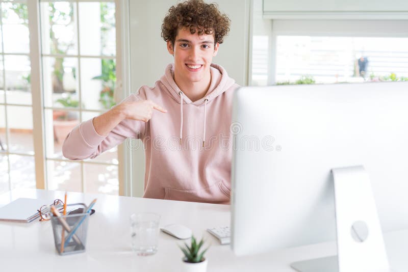Young Student Man Using Computer with Surprise Face Pointing Finger To ...