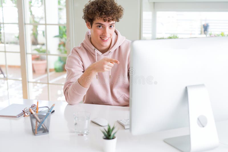 Young Student Man Using Computer Very Happy Pointing with Hand and ...