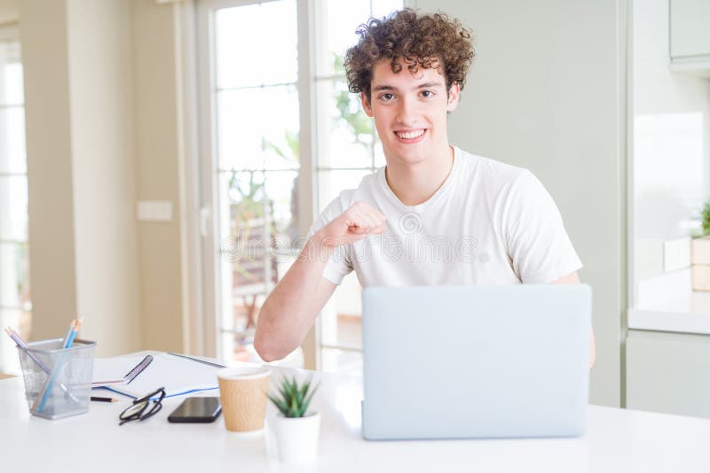 Young Student Man Working and Studying Using Computer Laptop with ...