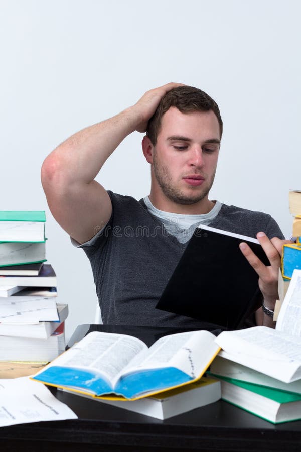 Young Student Overwhelmed with Studying Stock Photo - Image of books ...