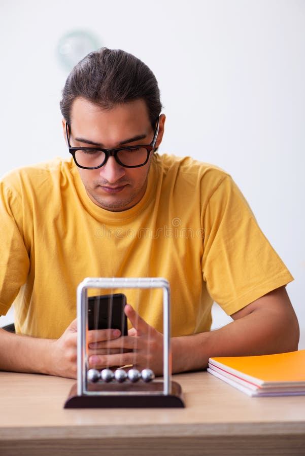 Young Male Student Physics Preparing for Exams in the Classroom Stock ...