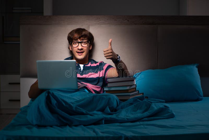 The Young Student Preparing for Exams at Night at Home Stock Photo ...