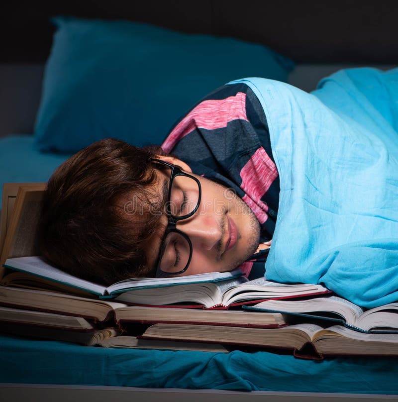 Young Student Preparing for Exams at Night at Home Stock Photo - Image ...