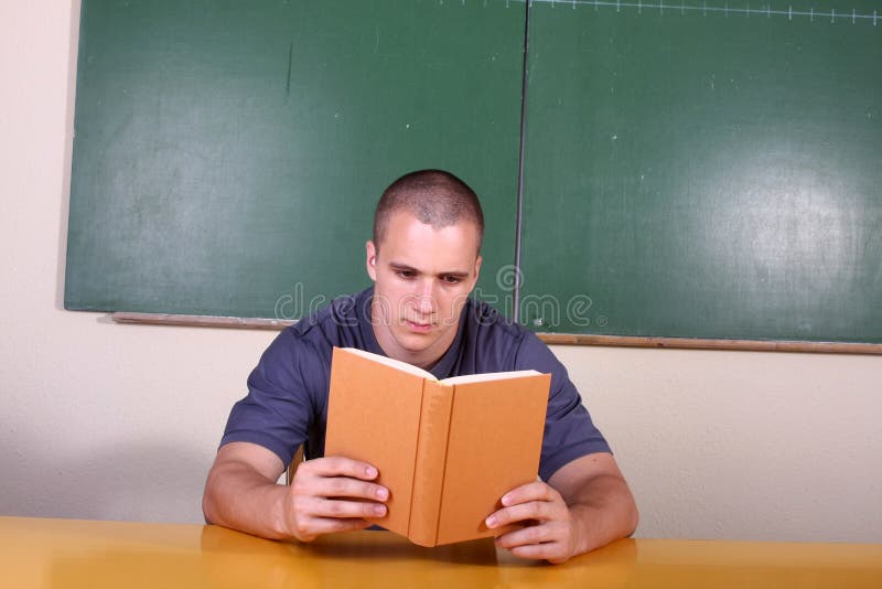 Young student reading stock photo. Image of office, concentration ...