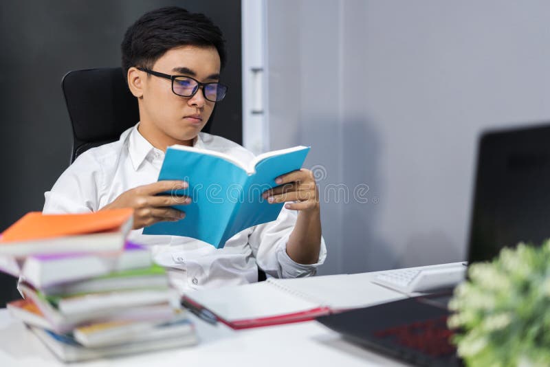 Young student reading book stock image. Image of home - 120978937