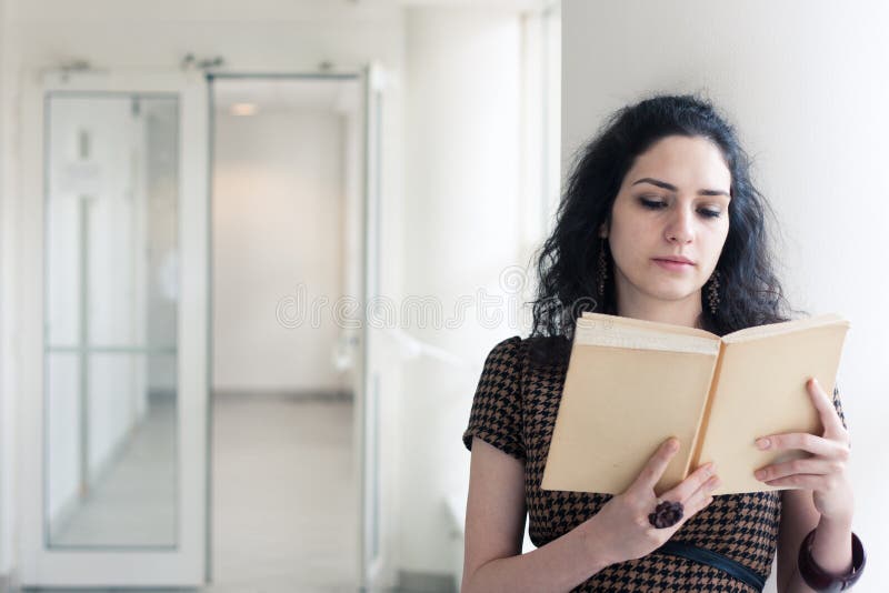 Young Student Reading a Book Stock Photo - Image of lecture, female ...
