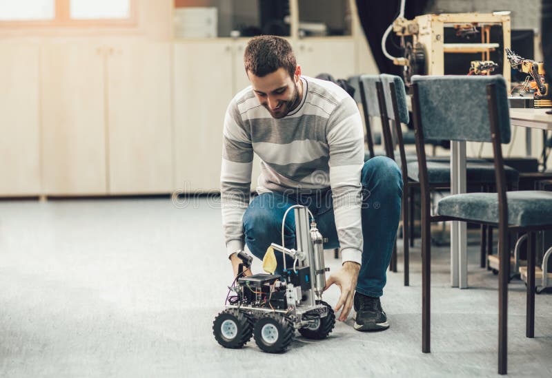 Young Student of Robotics Preparing Car Robot for Testing Stock Image ...