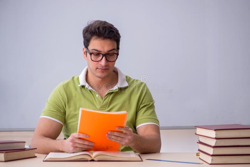 Young Male Student Sitting in the Classroom Stock Image - Image of exam ... Young Male Student Sitting in the Classroom Stock Image - Image of exam ...