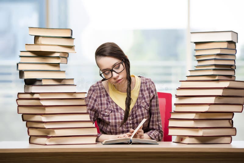 The Young Student with Stack of Books Stock Photo - Image of desk ...