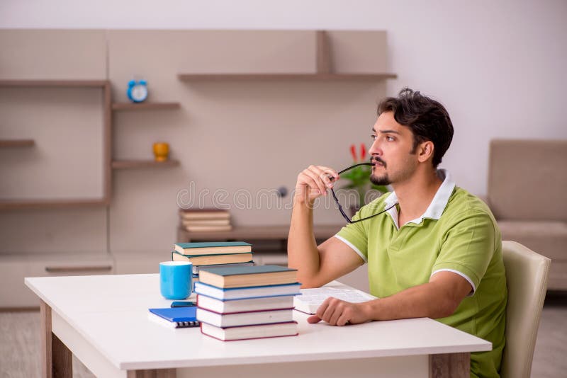 Young Male Student Studying at Home Stock Image - Image of specs ...