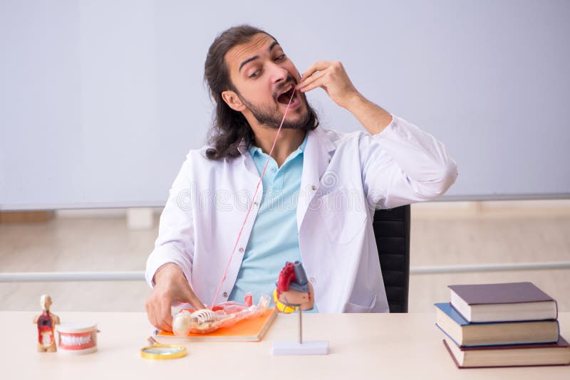 Young Male Student Studying Human Anatomy Stock Image - Image of books ...