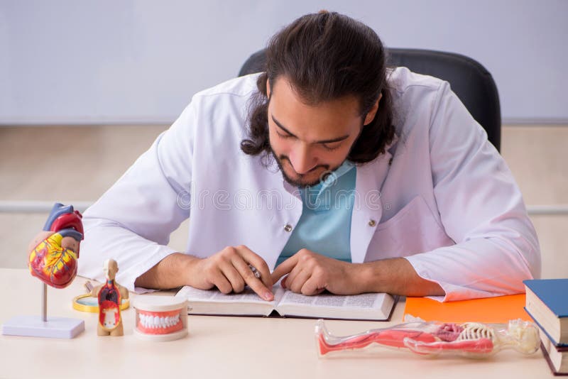 Young Male Student Studying Human Anatomy Stock Photo - Image of books ...