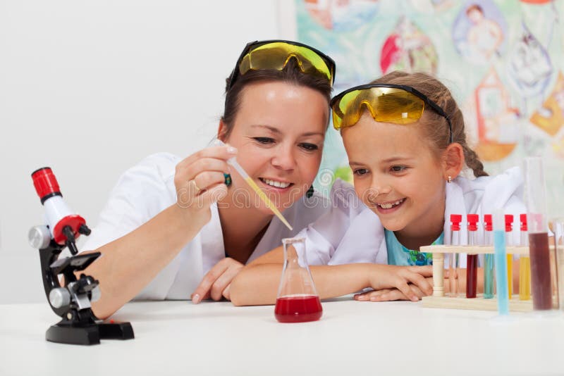 Young Student and Teacher in Science Class Stock Photo - Image of ...