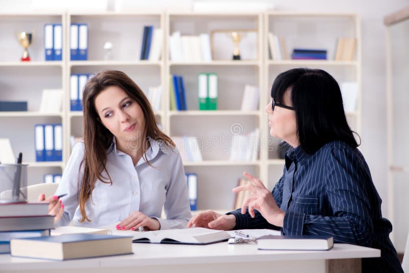 The Young Student and Teacher during Tutoring Lesson Stock Photo ...