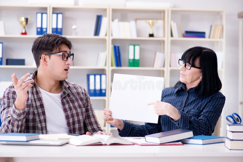 The Young Student and Teacher during Tutoring Lesson Stock Photo ...