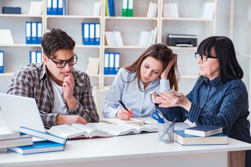 The Young Student and Teacher during Tutoring Lesson Stock Photo ...