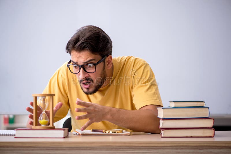 Young Male Student in Time Management Concept Stock Photo - Image of ...