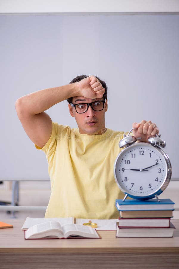 Young Male Student in Time Management Concept Stock Image - Image of ...