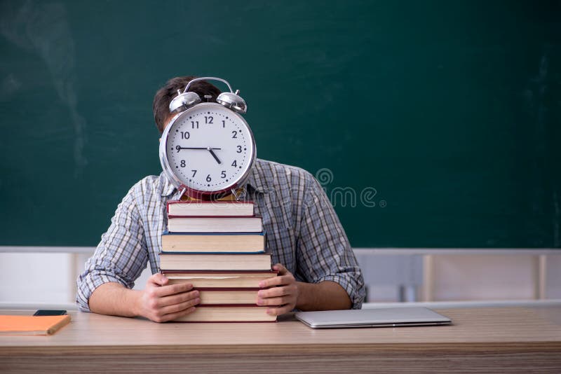 Young Male Student in Time Management Concept Stock Photo - Image of ...