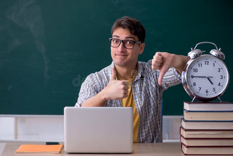 Young Male Student in Time Management Concept Stock Photo - Image of ...